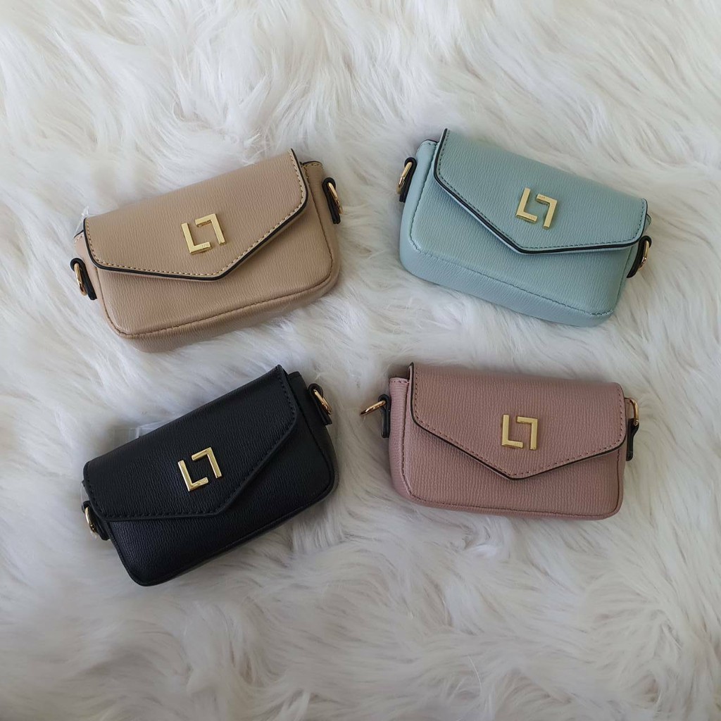 กระเป๋า lyn mini crossbody bag ด้านหน้าแต่งสัญลักษณ์แบรนด์ | Shopee ...