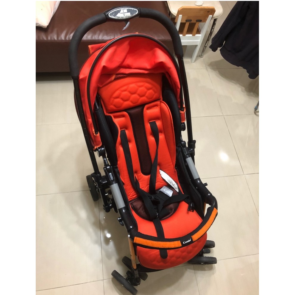 รถเข็นยี่ห้อ combi รุ่น Well comfort สีส้ม มือสอง สภาพดี | Shopee Thailand