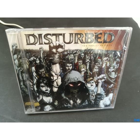 แผ่น CD JX03 The commotion band Disturbed Ten Thousand Fists aq50 ...