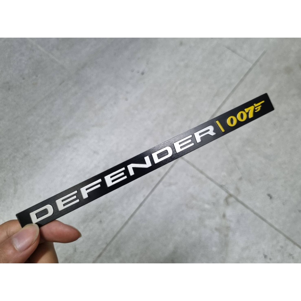 โลโก้ เพจดีเฟนเดอร์ 007 ติด แลนด์โรเวอร์ รุ่นเจมบอนด์ size 20 * 1.5 cm ...