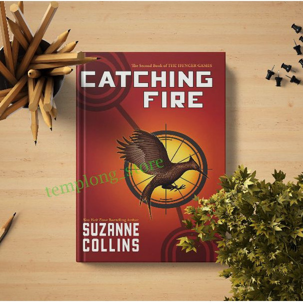 Catching Fire by Suzanne Collins (HARD COVER) | Shopee Thailand