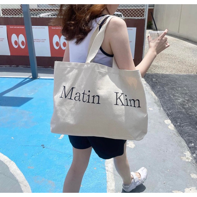(พร้อมส่ง) matin kim logo canvas bag กระเป๋า ของแท้100% | Shopee Thailand