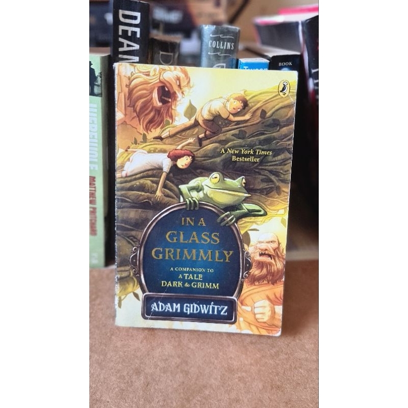 หนังสือภาษาอังกฤษIN A GLASS GRIMMLY(มือสอง) | Shopee Thailand