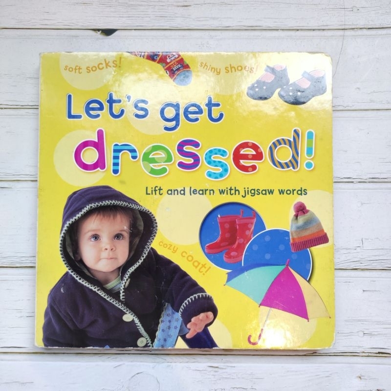 (มือสอง) หนังสือบอร์ดบุ๊คภาษาอังกฤษ Let's get dressed | Shopee Thailand