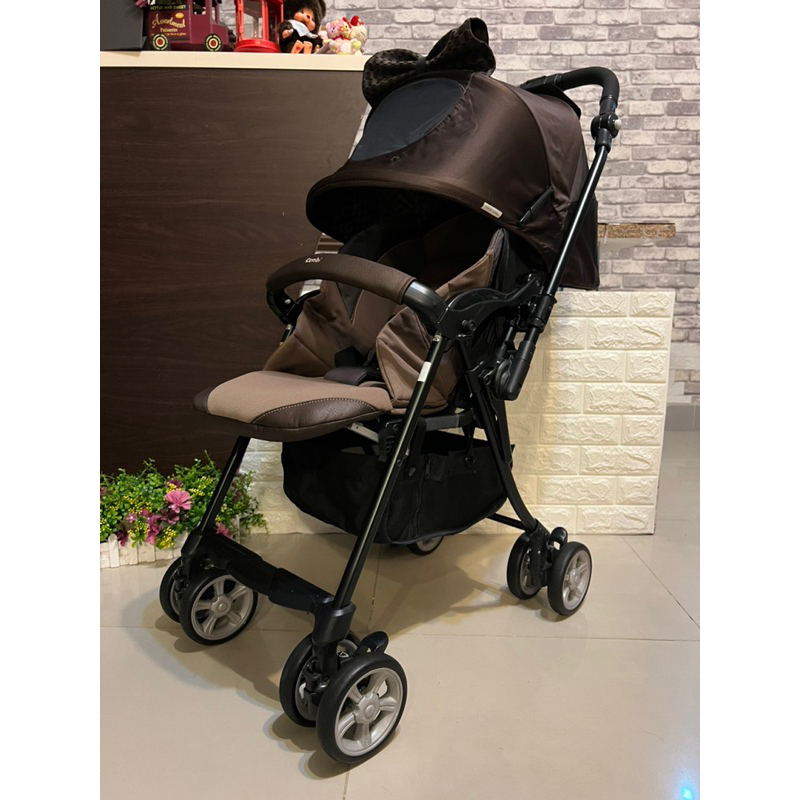 รถเข็น Combi รุ่น Miracle Turn auto 4 หลังคาลายหลุยส์ ปลายเบาะหนังสีน้ำตาล | Shopee Thailand