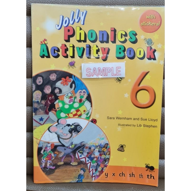 Used Jolly Phonics activity book 6 เป็นหนังสือตัวอย่าง มีแสตมป์คำว่า ...