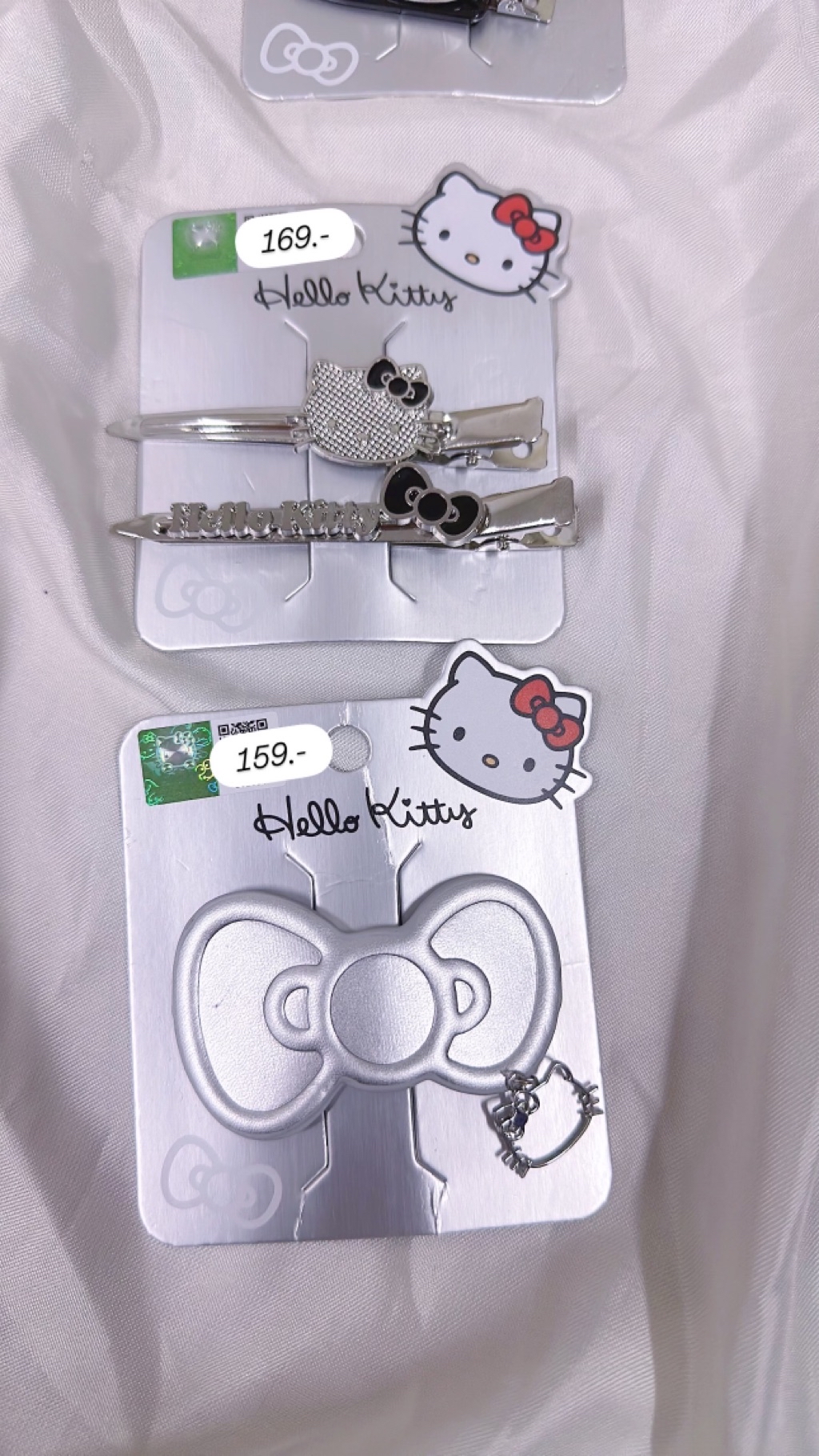 MINISO x Hello Kitty คอลเลกชั่นสีเงิน เทสดี กิ้บติดผม ยางโดนัทรัดผมมา ...